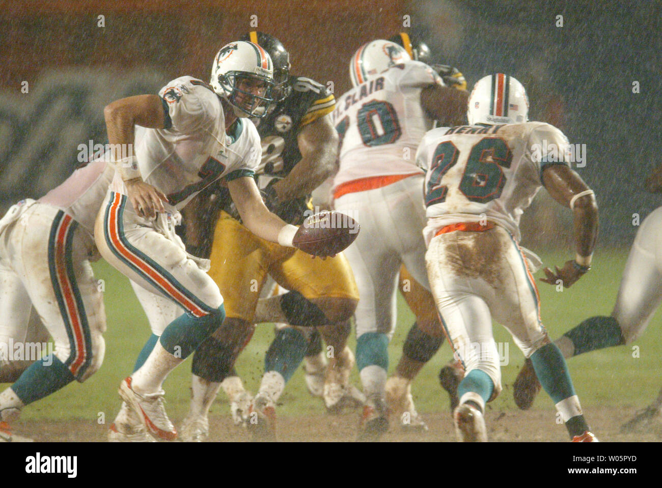 The Miami Dolphins quarterback A.J. Feeley (7) hands off in first ...