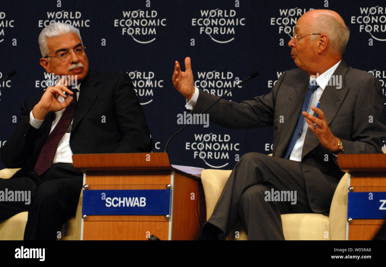 Klaus Schwab (R), addresses the closing session of the World Economic ...