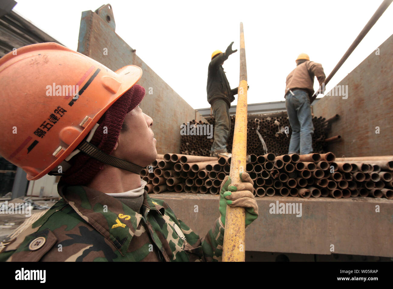Chinese construction workers continue work on Hongqiao international ...