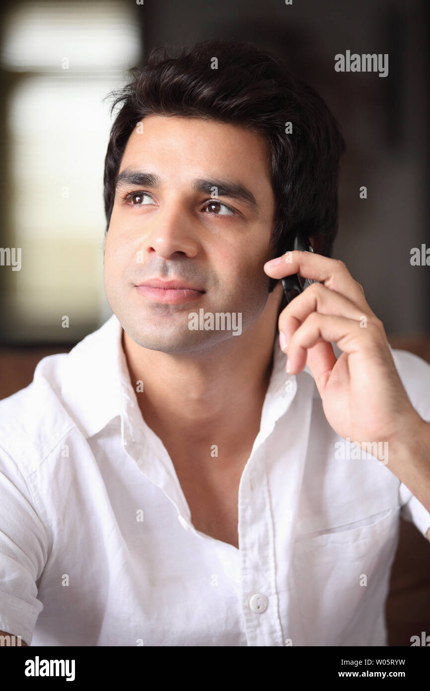 Indian talking mobile phone human face hi-res stock photography and ...
