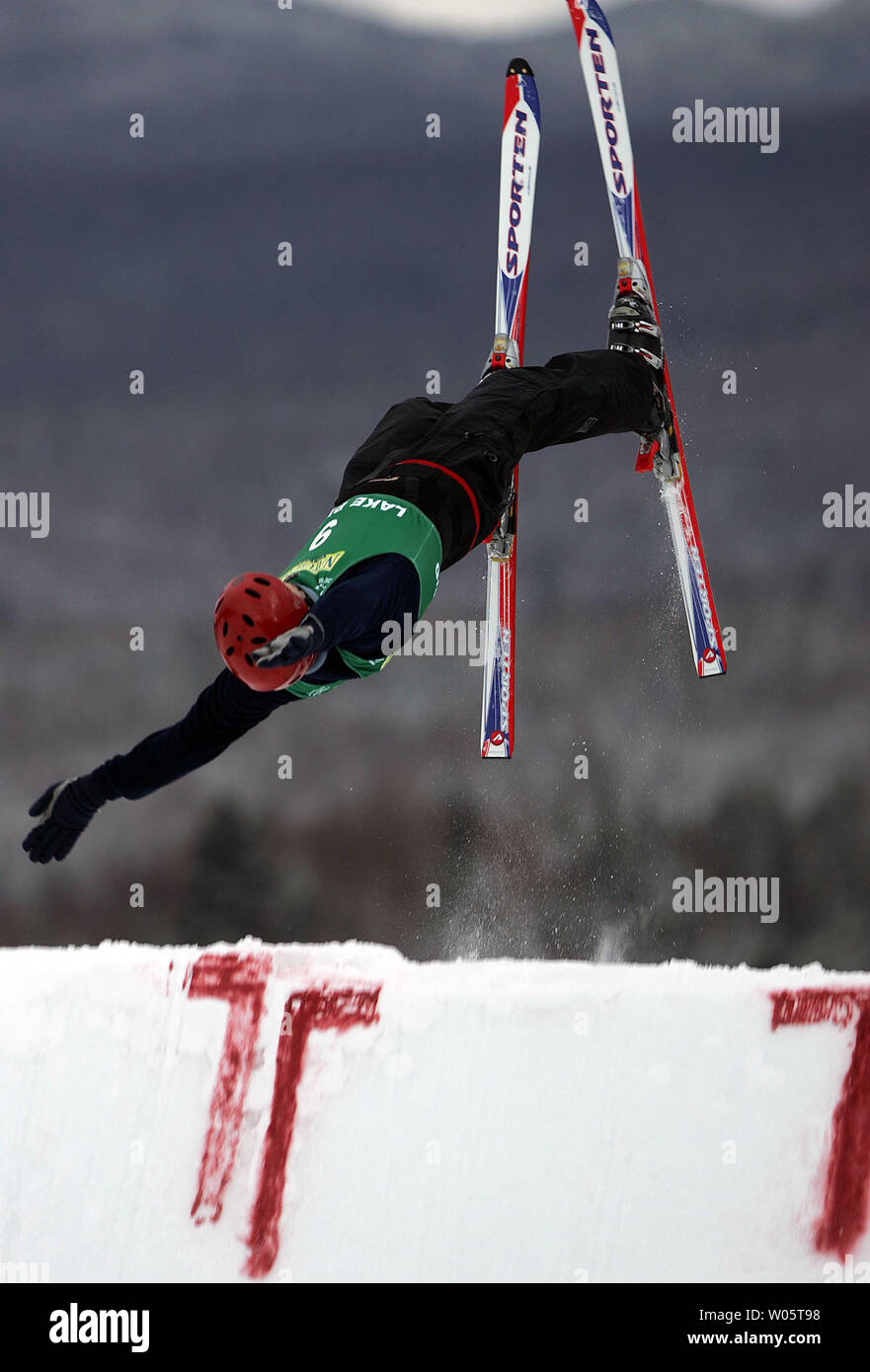Russian aerialist Dmitri Arkhipov takes off for a quadruple-twisting ...