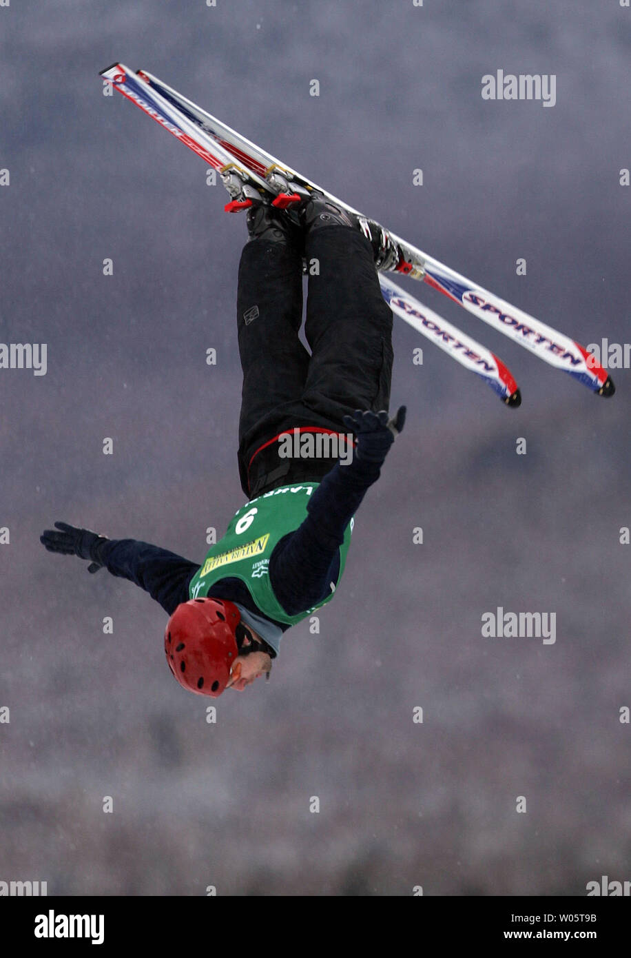 Russian aerialist Dmitri Arkhipov performs a quadruple-twisting triple ...