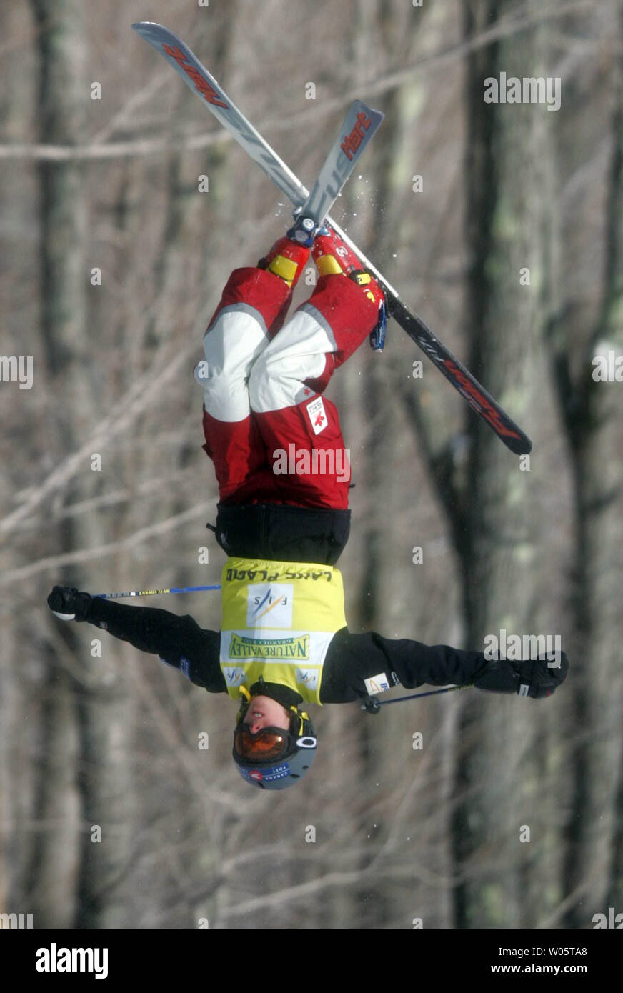 Canadian moguls skier Jennifer Heil performs a flip en route to winning ...