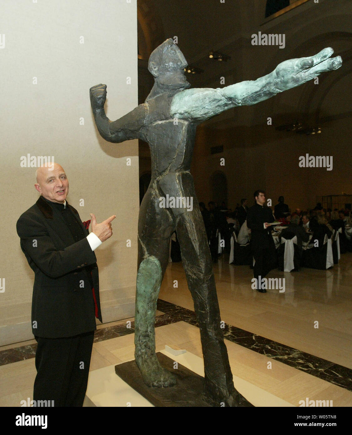 Artist Markus Lupertz playfully points to his creation "Titan" during a ...