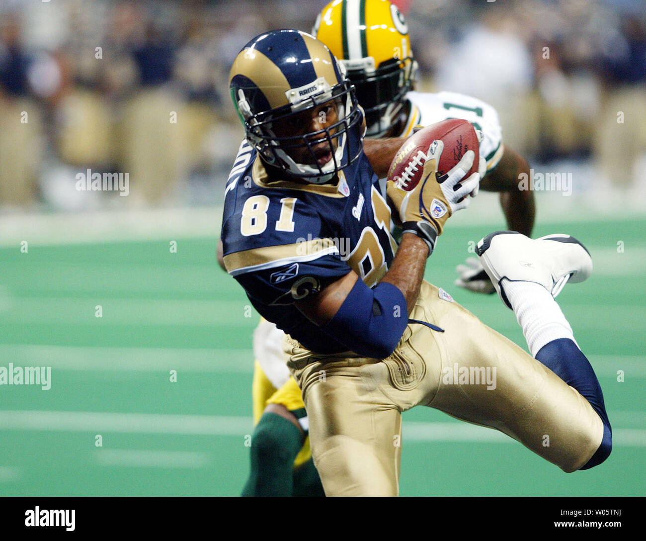 St. Louis Rams Torry Holt catches the football in front of Green Bay ...