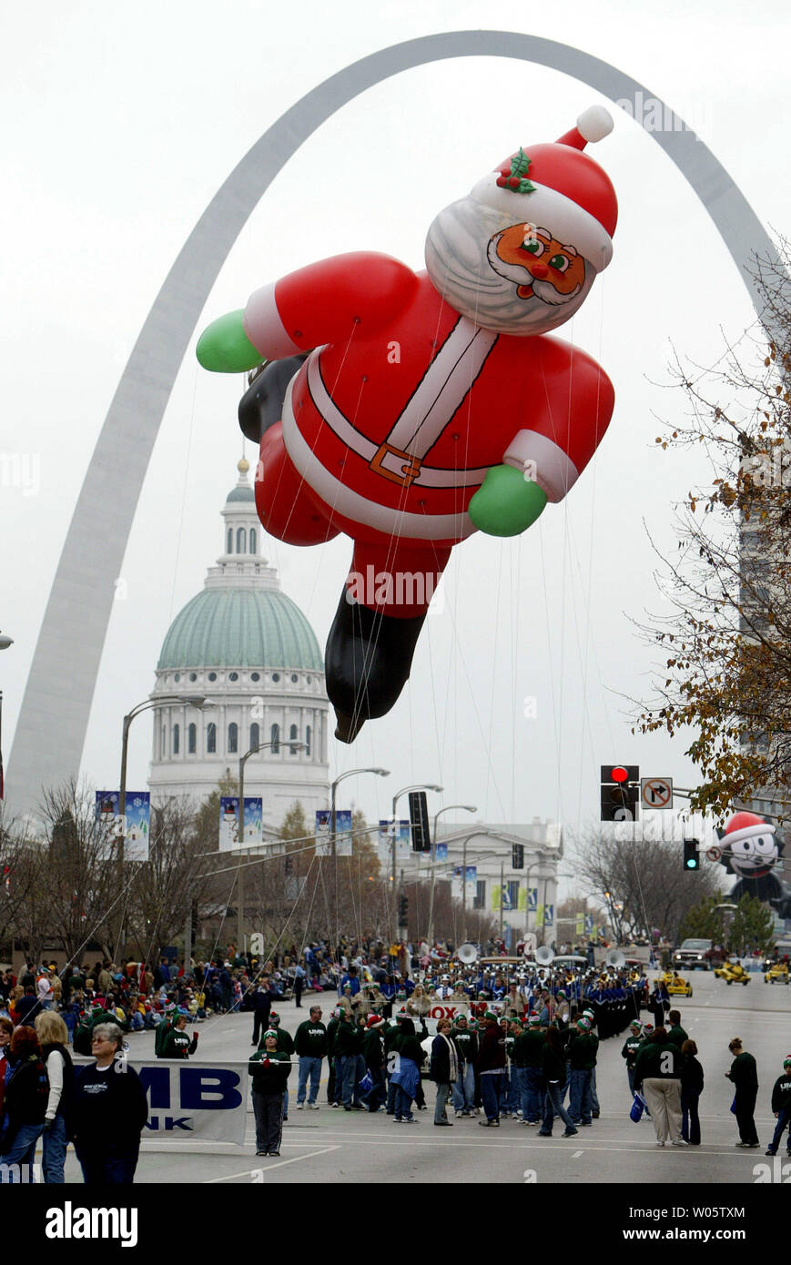 A large Santa balloon makes its way down Market Street during the St ...
