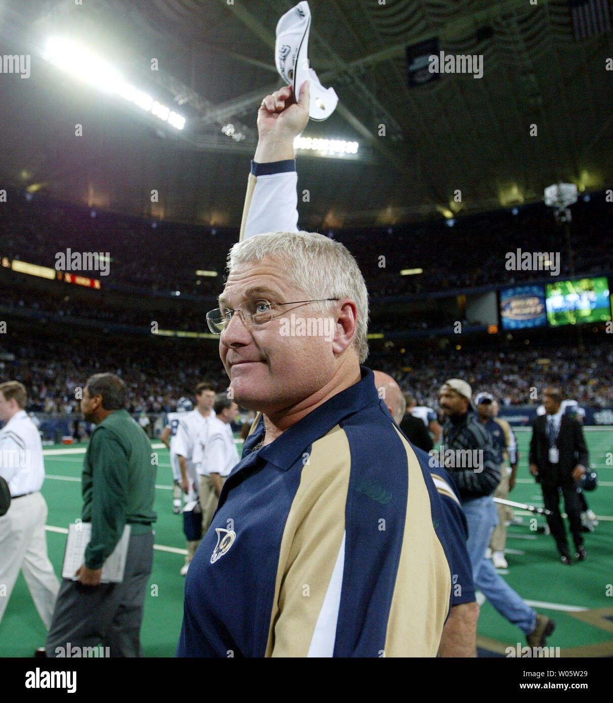 St. Louis Rams head football coach Mike Martz waves to the crowds as he ...