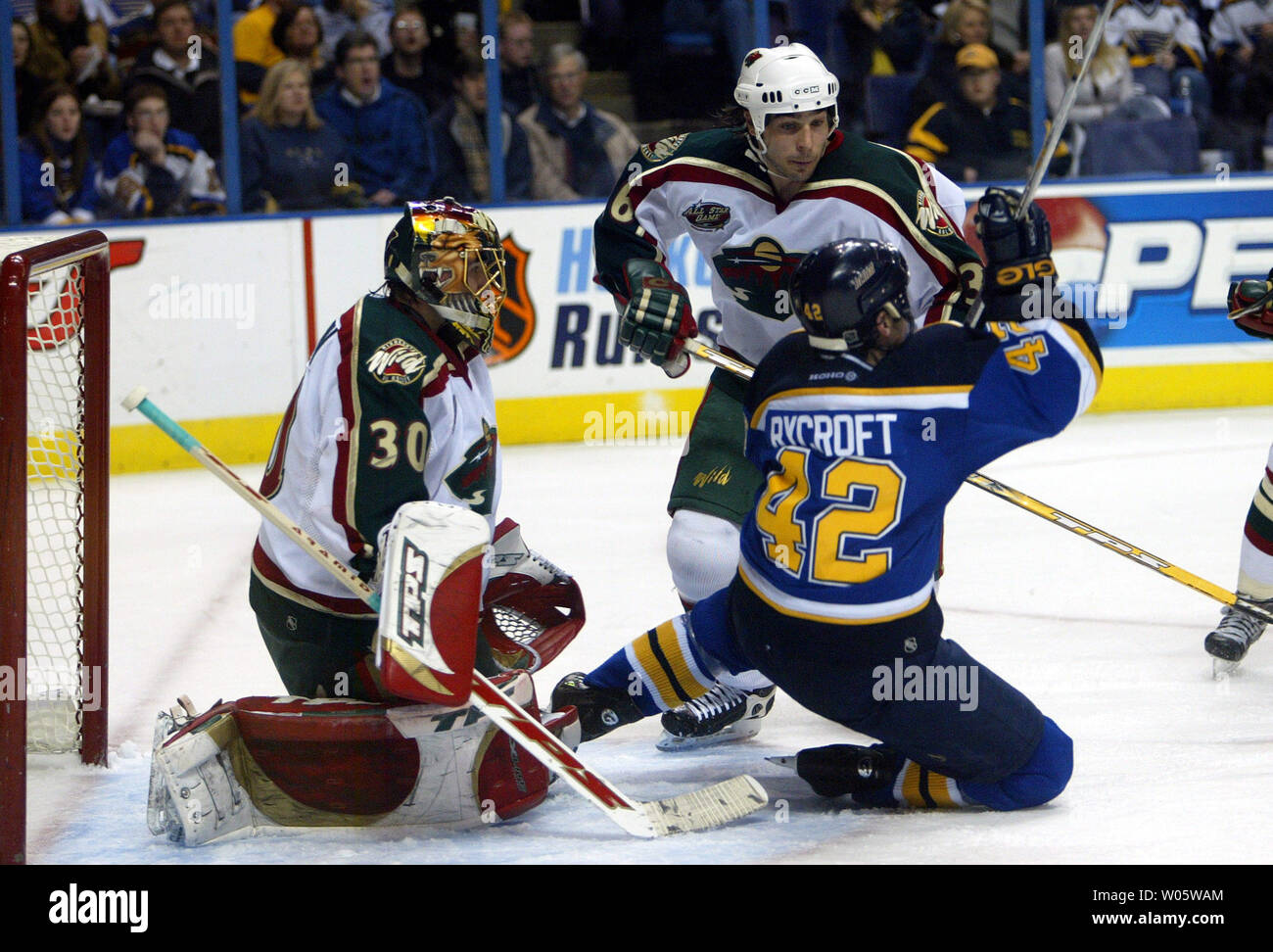 Minnesota Wild's Alex Harvey clears the goal mouth as he knocks down St ...