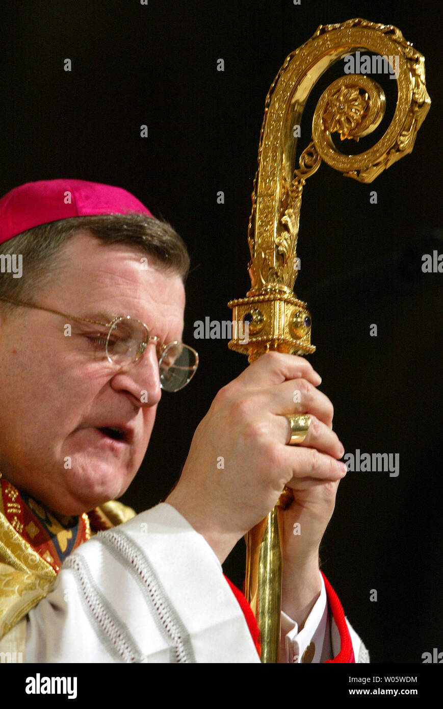 The new Archbishop of St. Louis, Raymond Burke, prays during his ...
