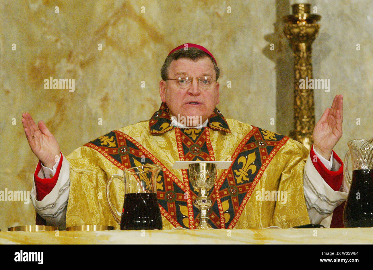 The new Archbishop of St. Louis, Raymond Burke, prays during his ...