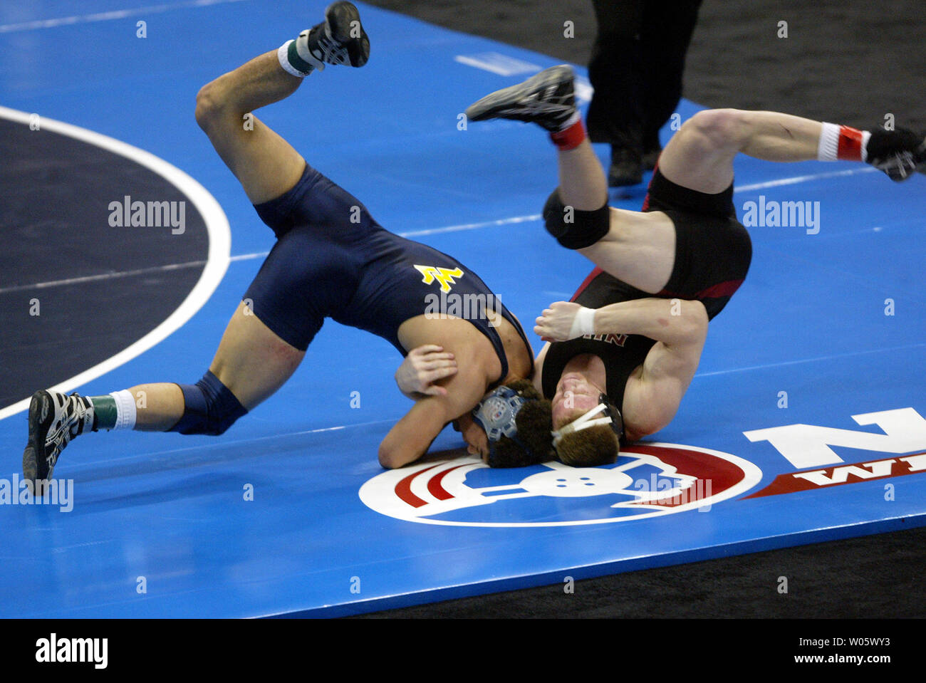 Greg Jones of West Virginia (L) collides with Ben Heizer of Northern ...