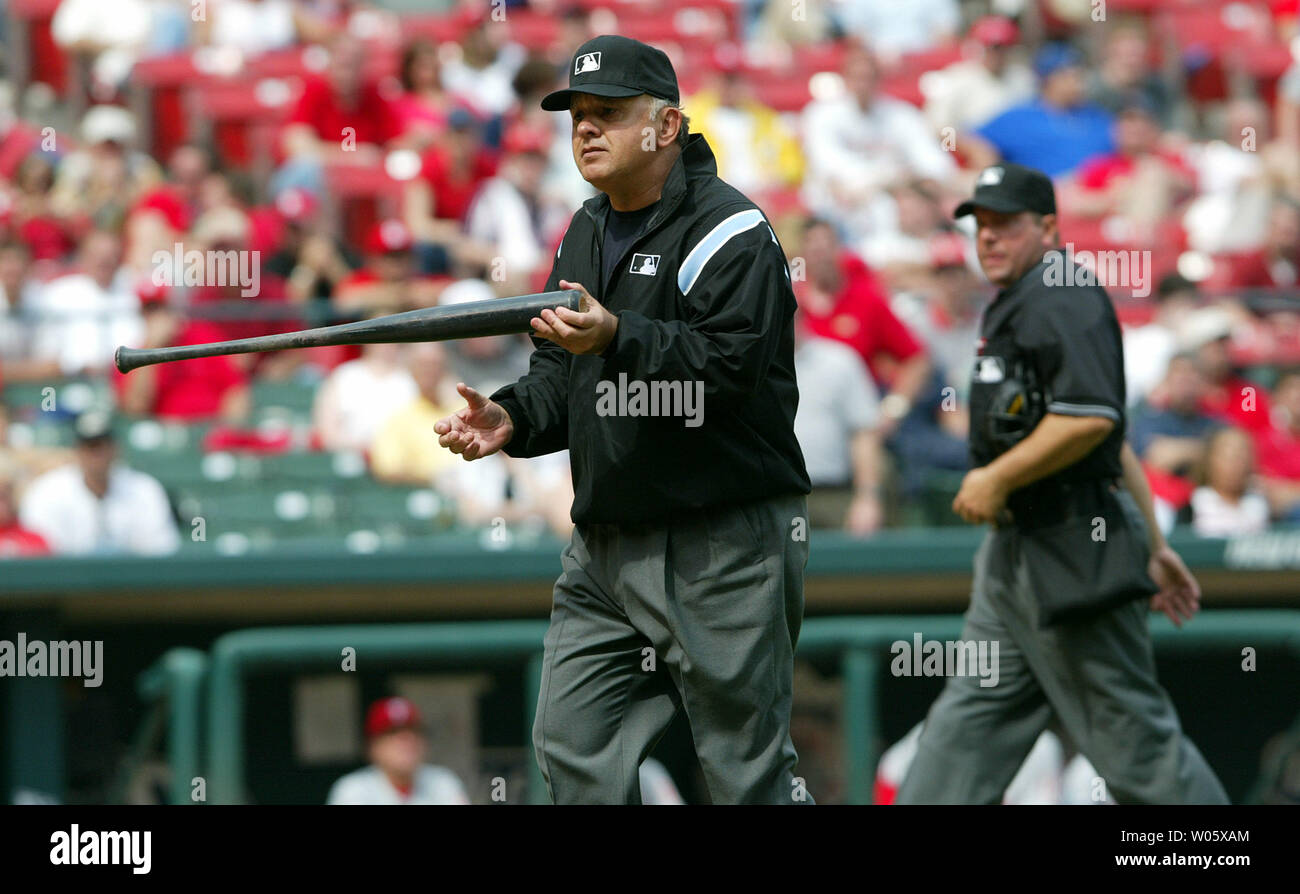 Umpire crew chief Randy Marsh shows St. Louis Cardinals manager Tony ...