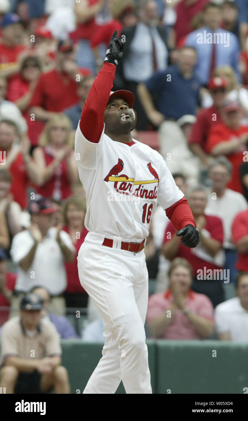 St. Louis Cardinals Reggie Sanders (points to the sky after hitting a ...