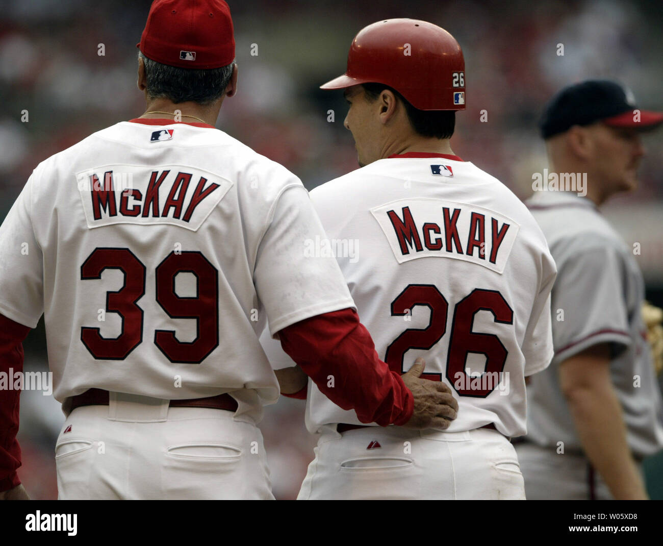 St. Louis Cardinals catcher Cody McKay (R) gets a pat on the back from ...