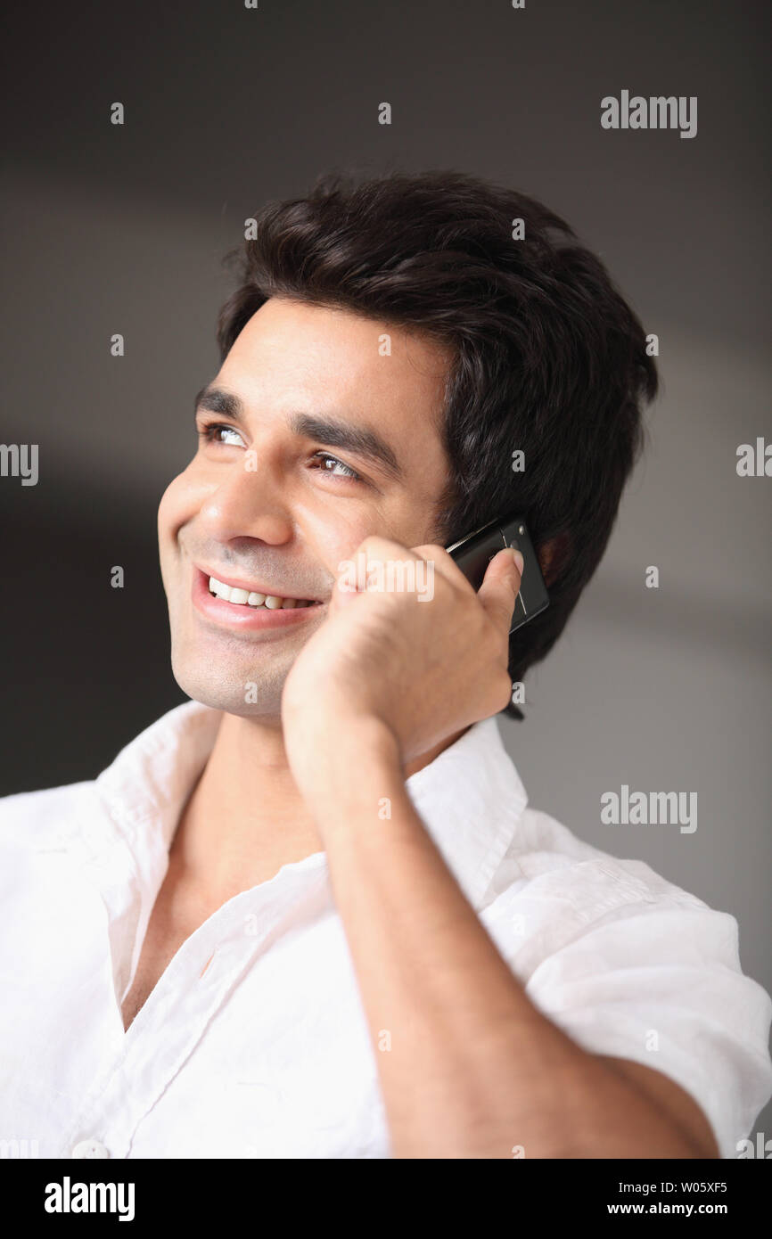 Indian talking mobile phone human face hi-res stock photography and ...