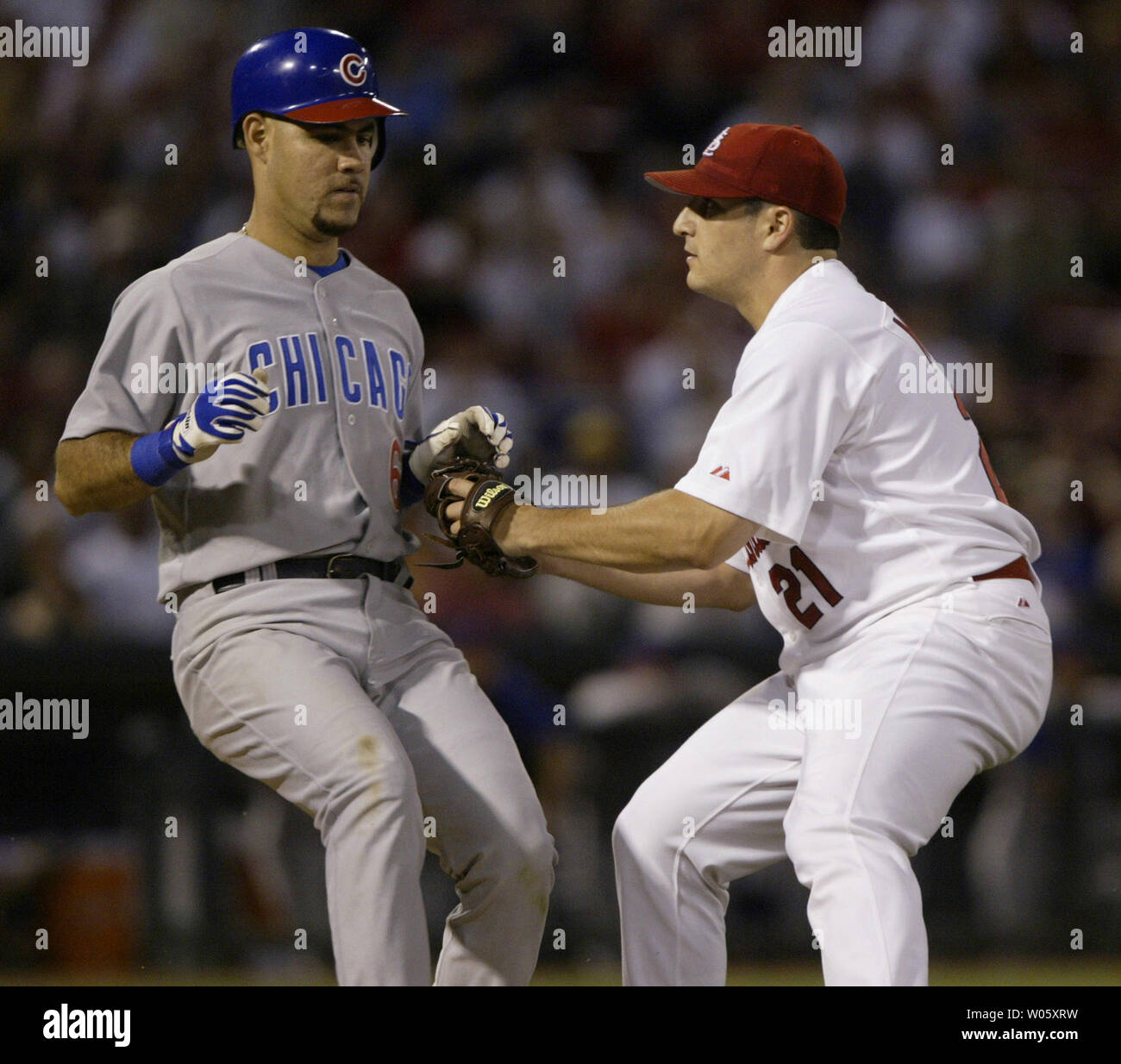 St. Louis Cardinals pitcher Jason Marquis (R) tags out Chicago Cubs ...