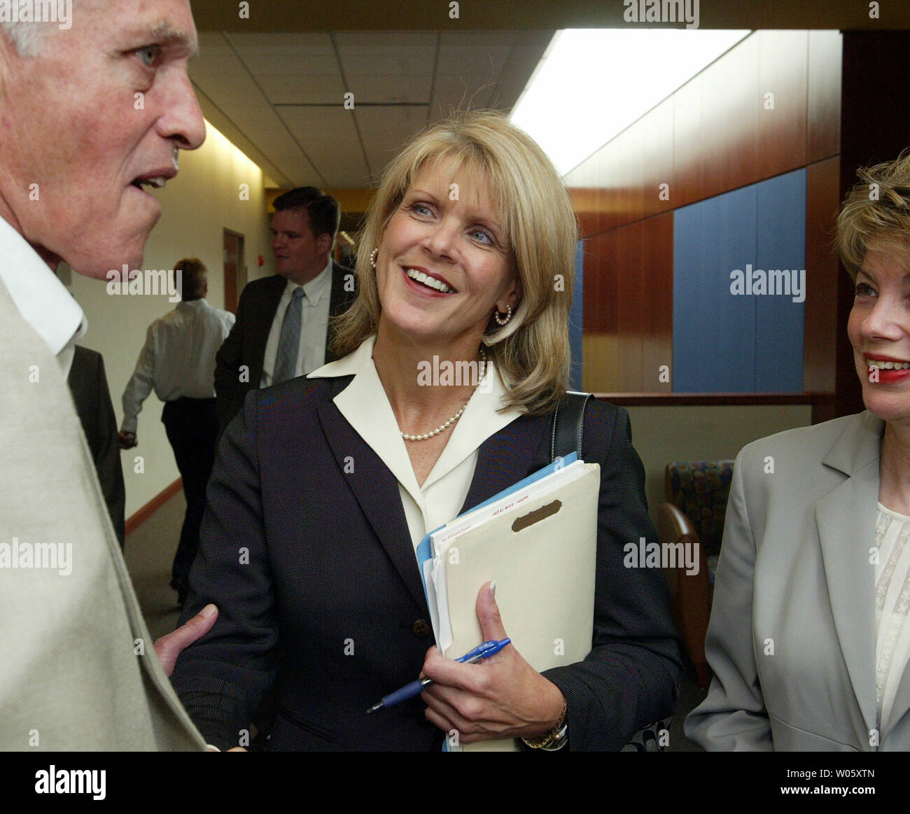 Cheryl L. Levick (C) visits with Saint Louis University supporters ...
