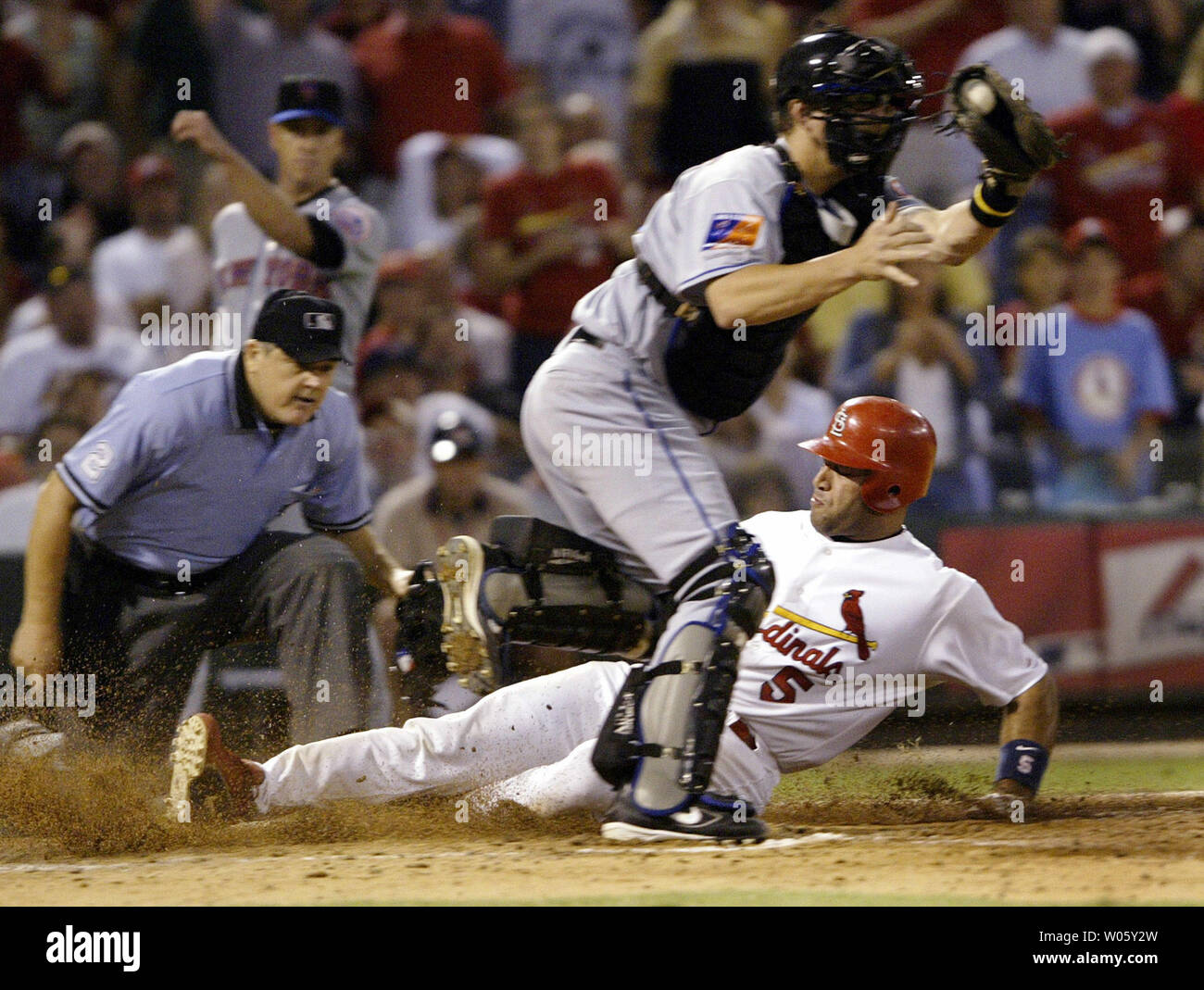 St. Louis Cardinals Albert Pujols slides safely into homeplate ...