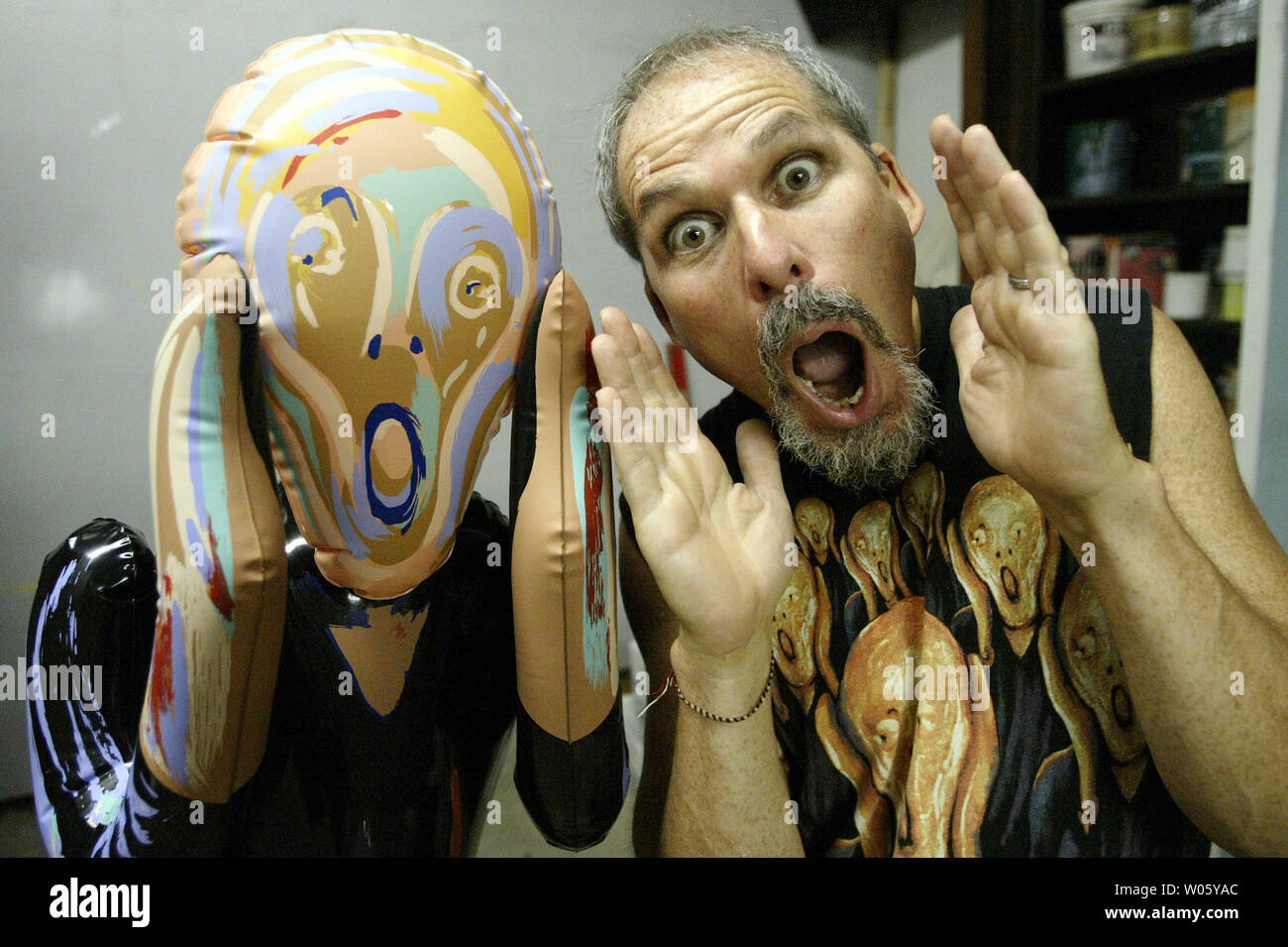 Robert Fishbone, owner of On The Wall Productions, poses with a scream ...