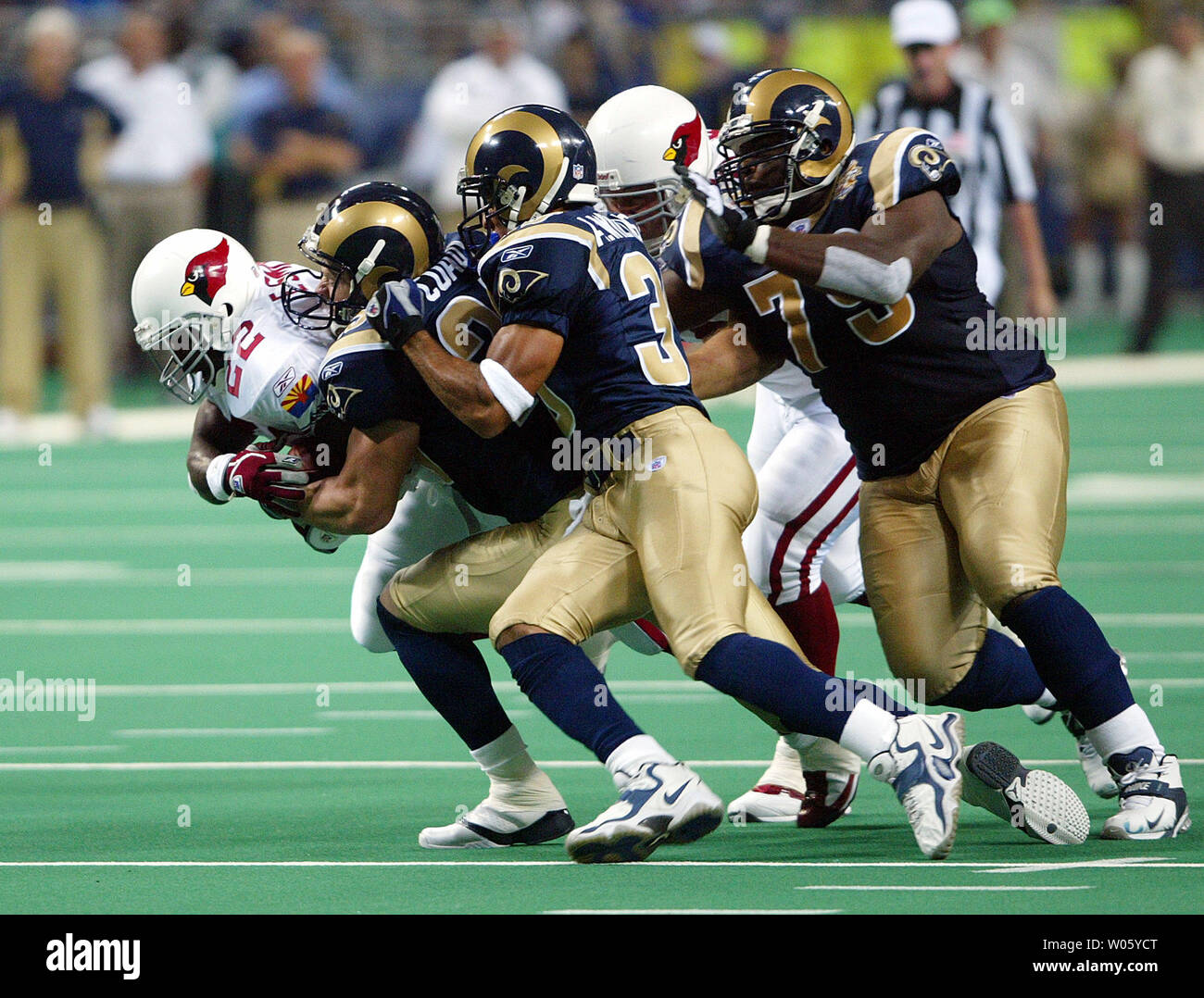 Arizona Cardinals Emmitt Smith (L) is brought down by the St. Louis ...