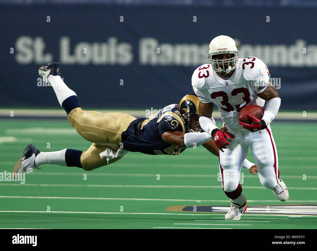 Arizona Cardinals Josh Scobey avoids a flying tackle by St. Louis Rams ...
