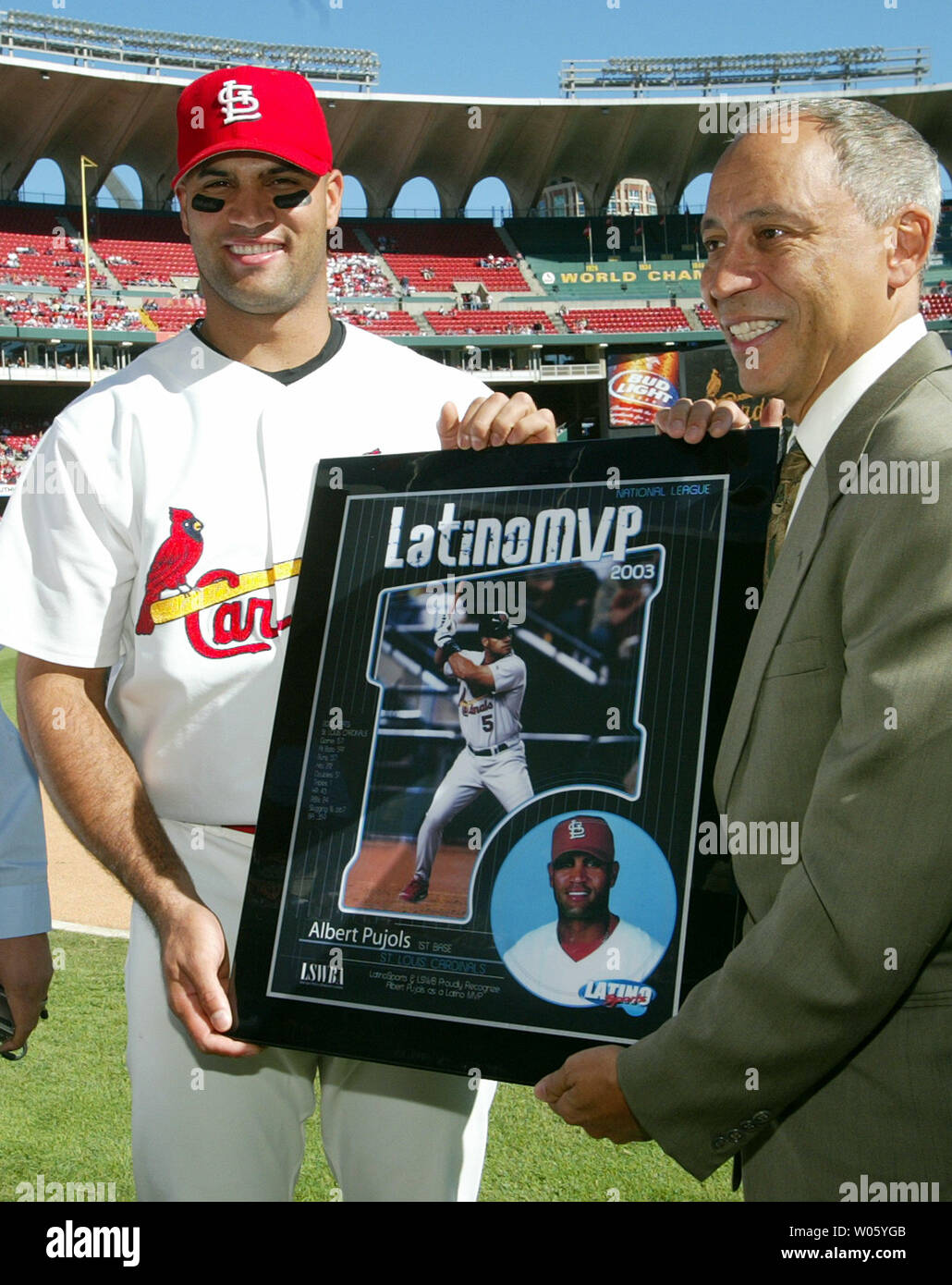 St. Louis Cardinals Albert Pujols stands with Julio Pabon, president of ...
