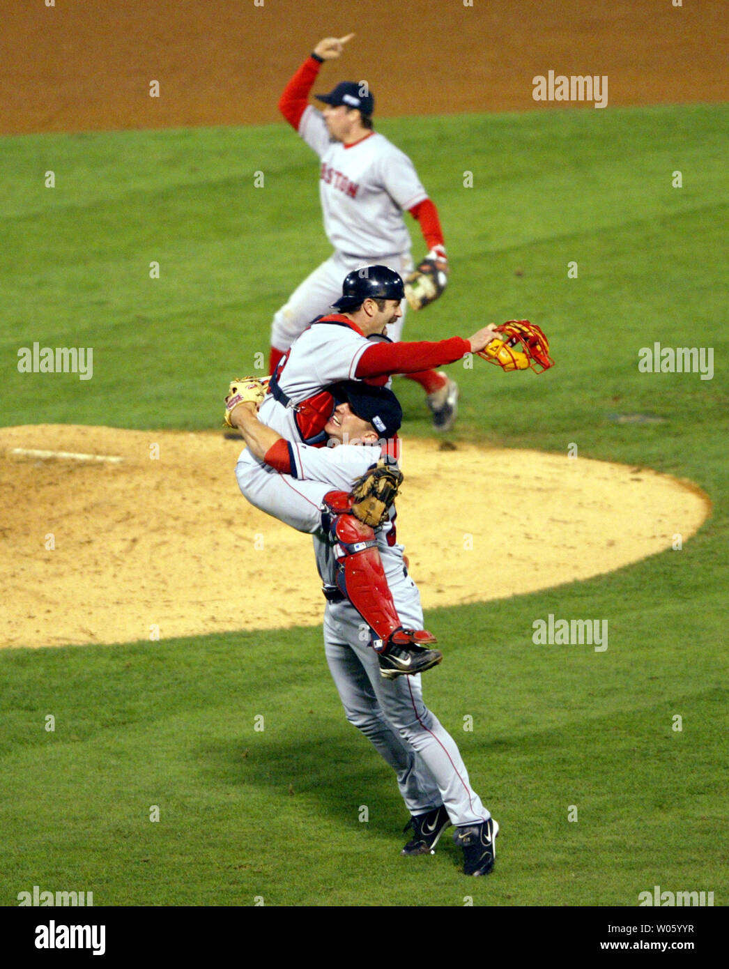 Boston Red Sox catcher Jason Varitek jumps into the arms of pitcher ...