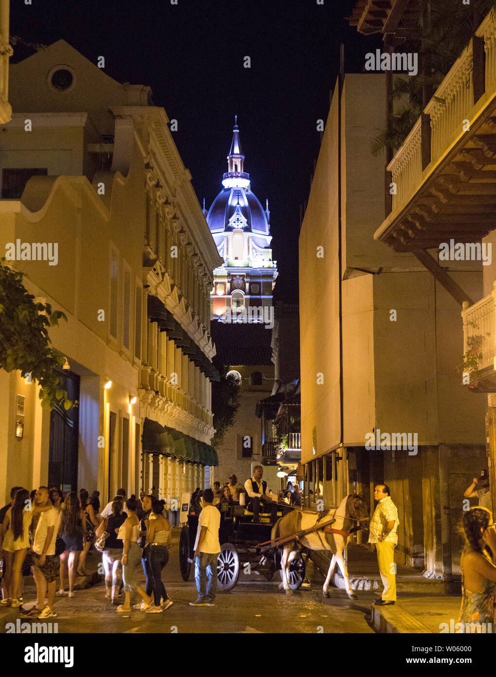 The bustling streets of the center of Cartagena, Colombia, at nighttime ...