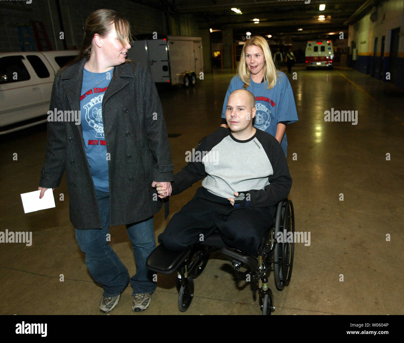 St. Louis Police officer Matt Browning, accompanied by girl friend ...