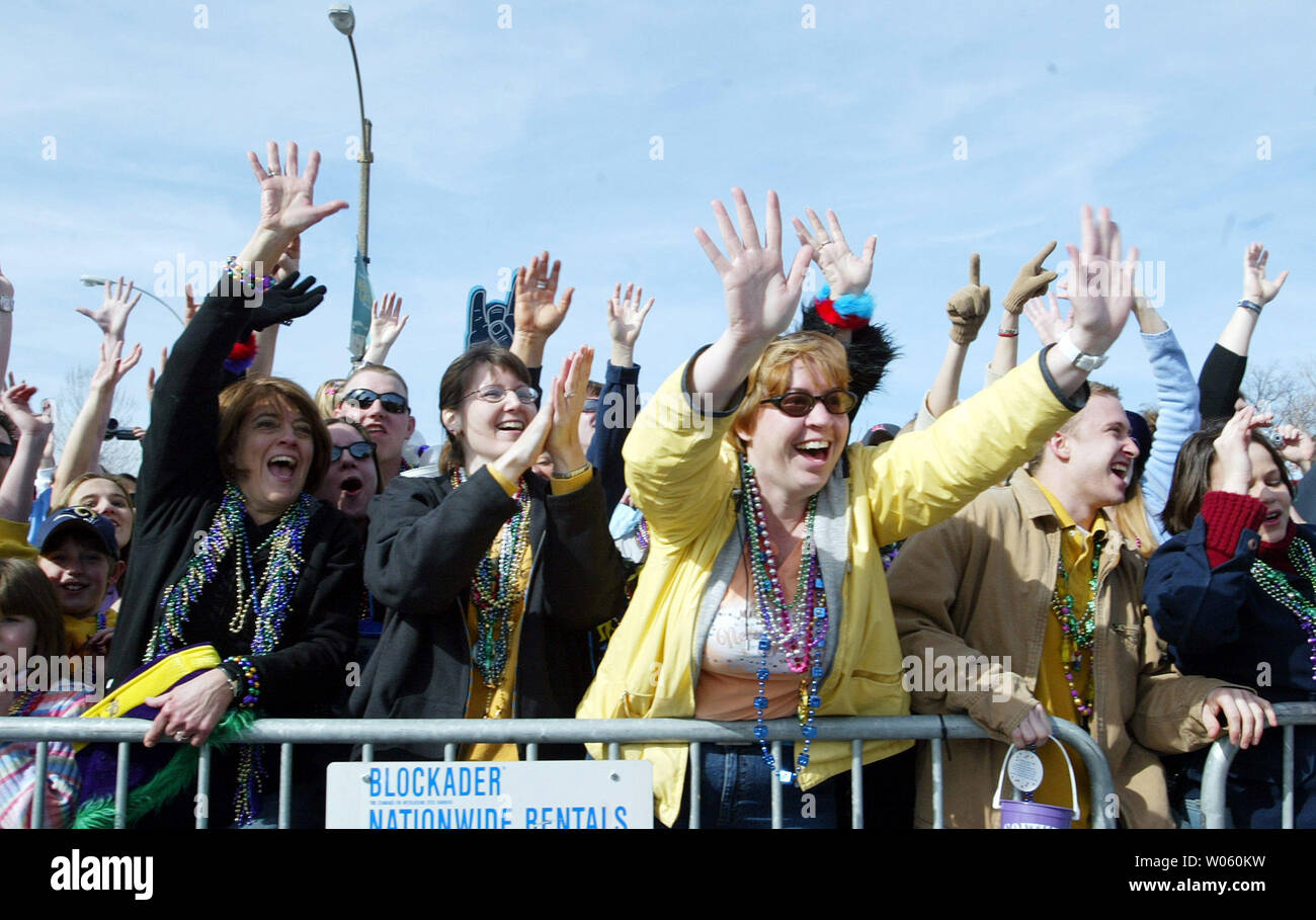 Crowds on the 2005 Mardi Gras Parade route yell for beads as fight ...