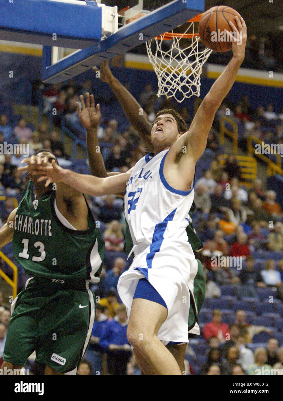 Saint Louis University Billikens Luke Meyer (R) slips past Charlotte ...