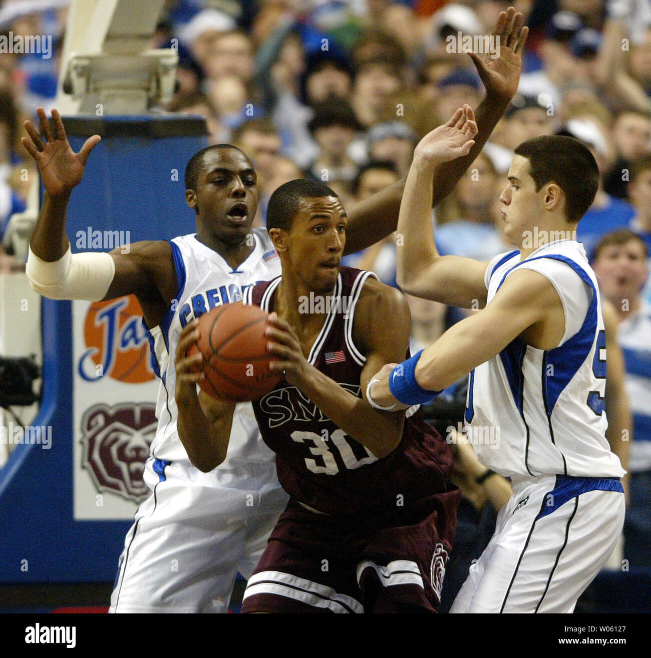 Southwest Missouri States' Kellen Easley (30) looks for daylight as ...