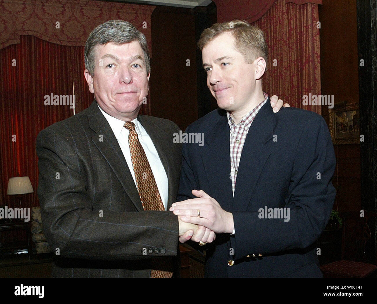 Rep. Roy Blunt (L) greets his son Missouri Gov. Matt Blunt during a ...