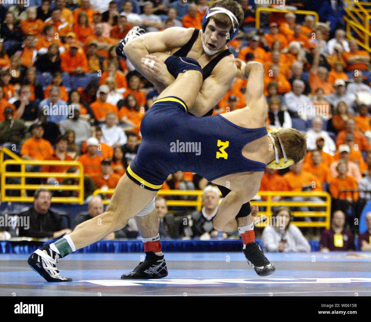 Joe Johnston of Iowa upsends Michigan's Ryan Bertin in the opening ...