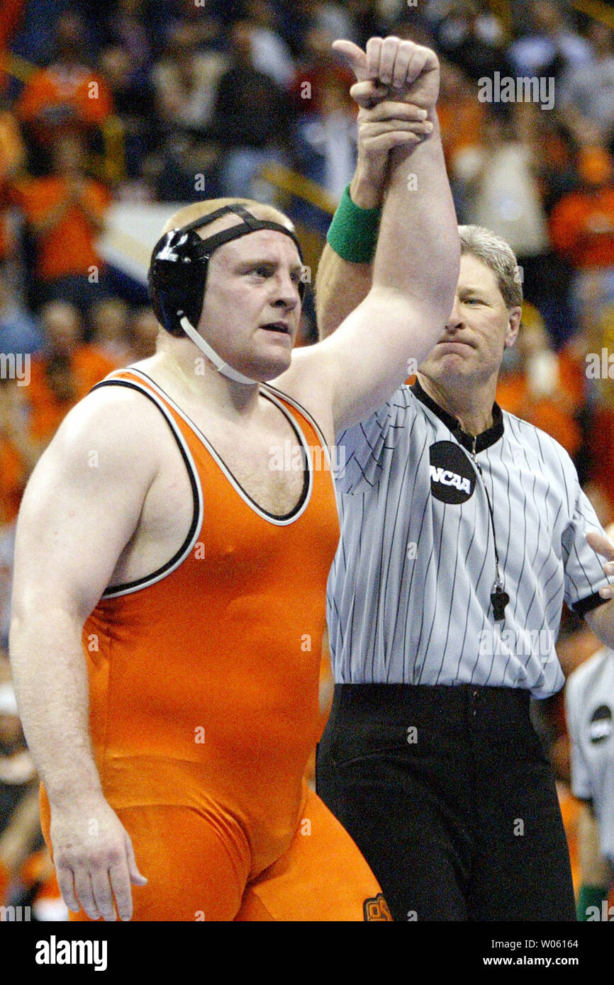 Heavyweight wrestler Steve Mocco of Oklahoma State is declared the winner over Minnesota's Cole ...