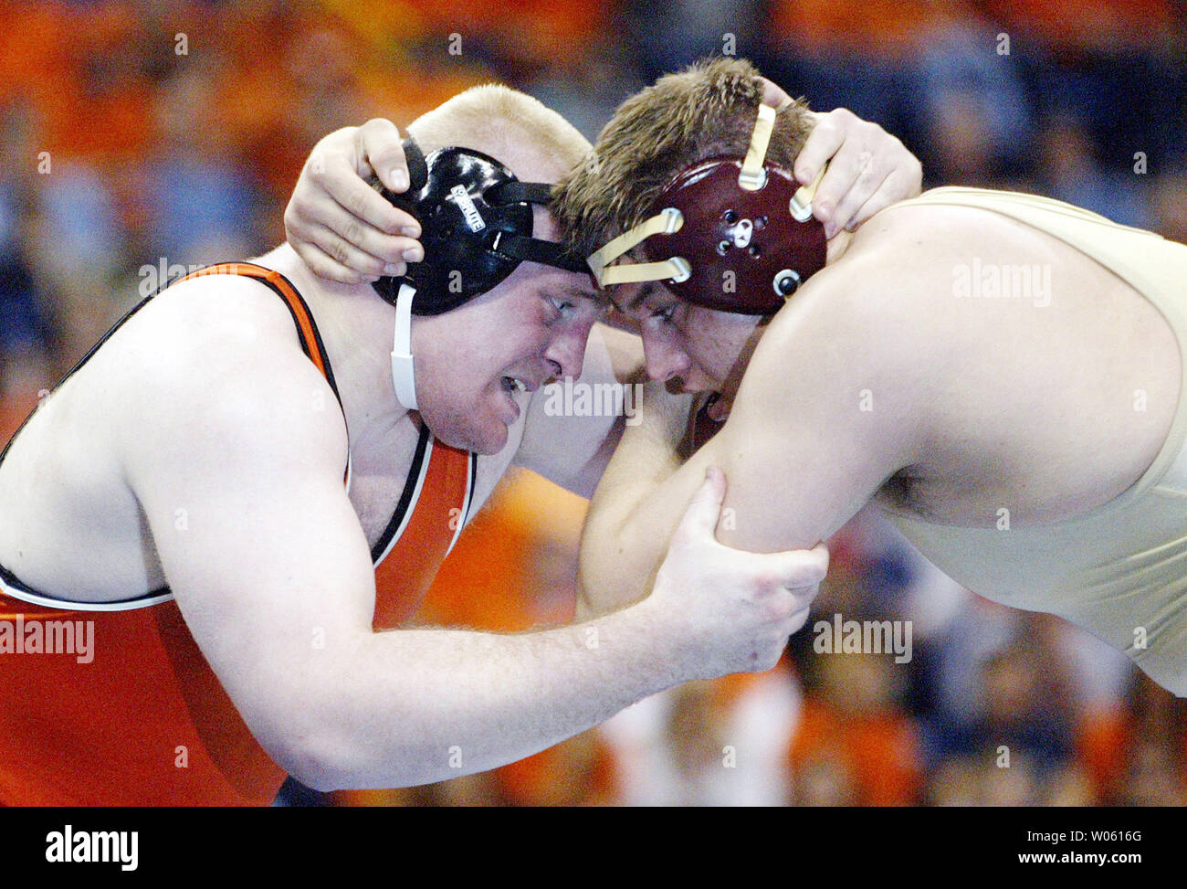 Heavyweight wrestlers Steve Mocco of Oklahoma State (L) and Minnesota's Cole Konrad mett head to ...