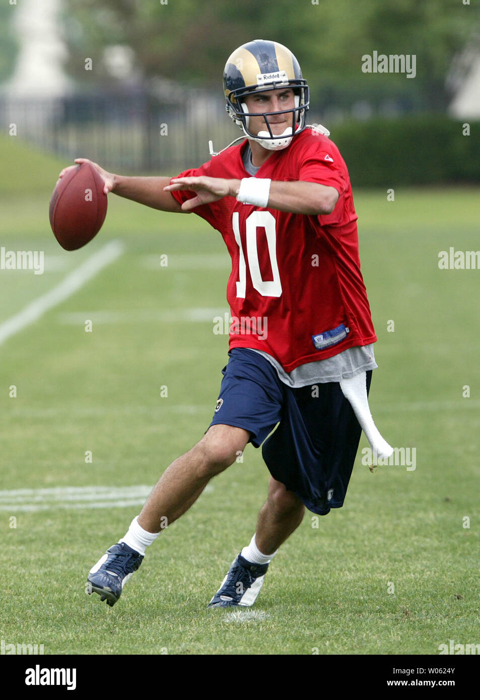 St. Louis Rams quarterback Mark Bulger rolls out as he throws during ...