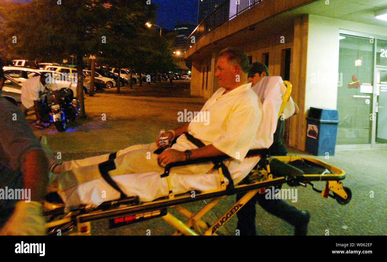 Homeplate umpire Rick Reed is removed from Busch Stadium on a stretcher ...