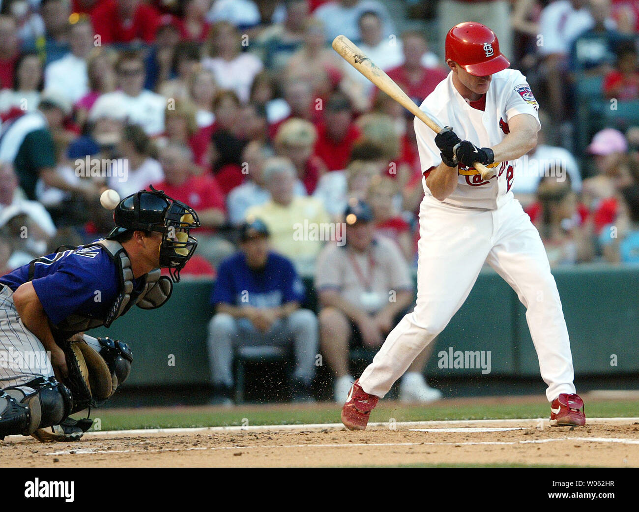 Colorado Rockies catcher Danny Ardoin cant find the baseball as St ...