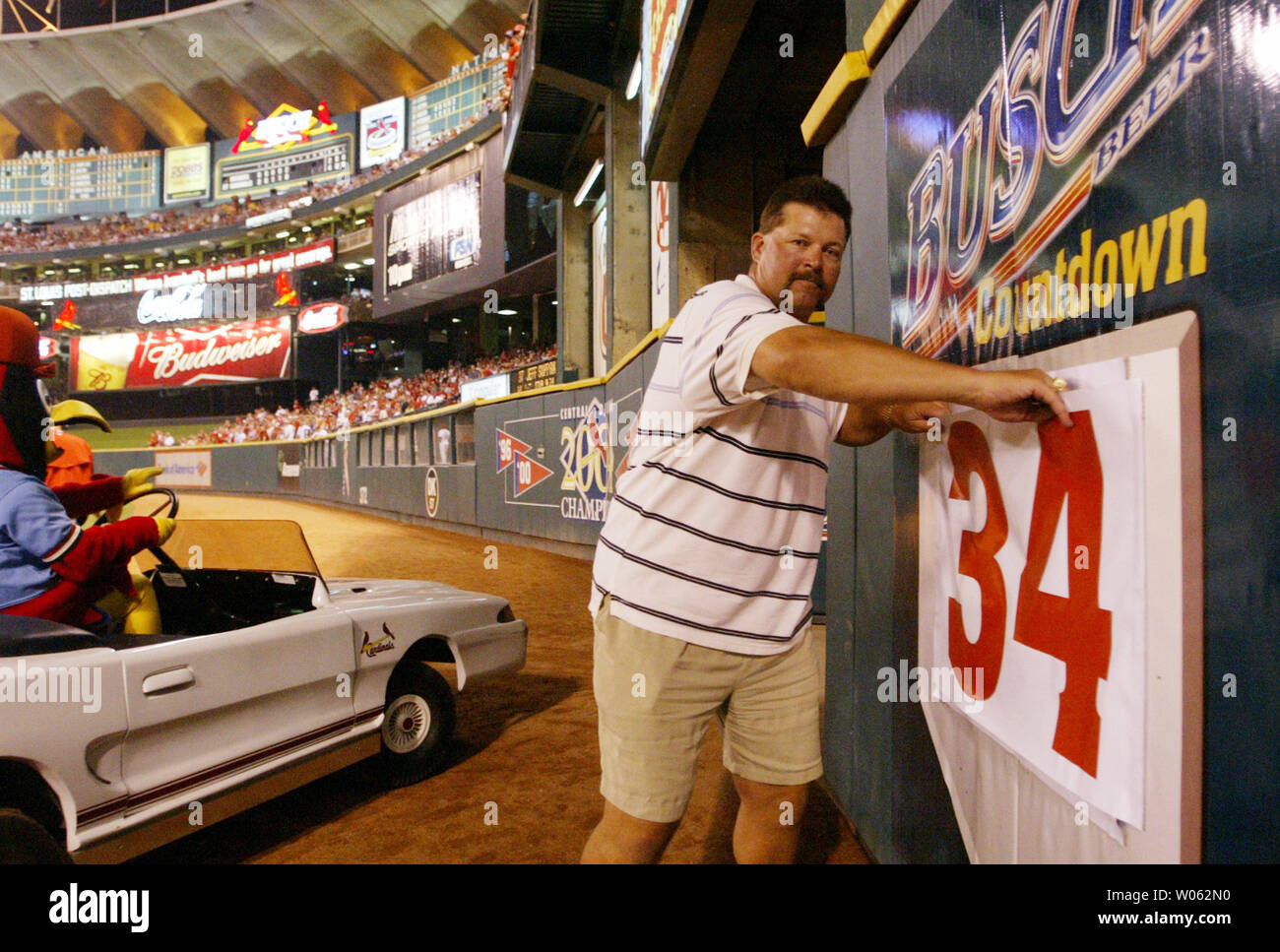 Former St. Louis Cardinals Danny Cox removes the number 34 from the ...