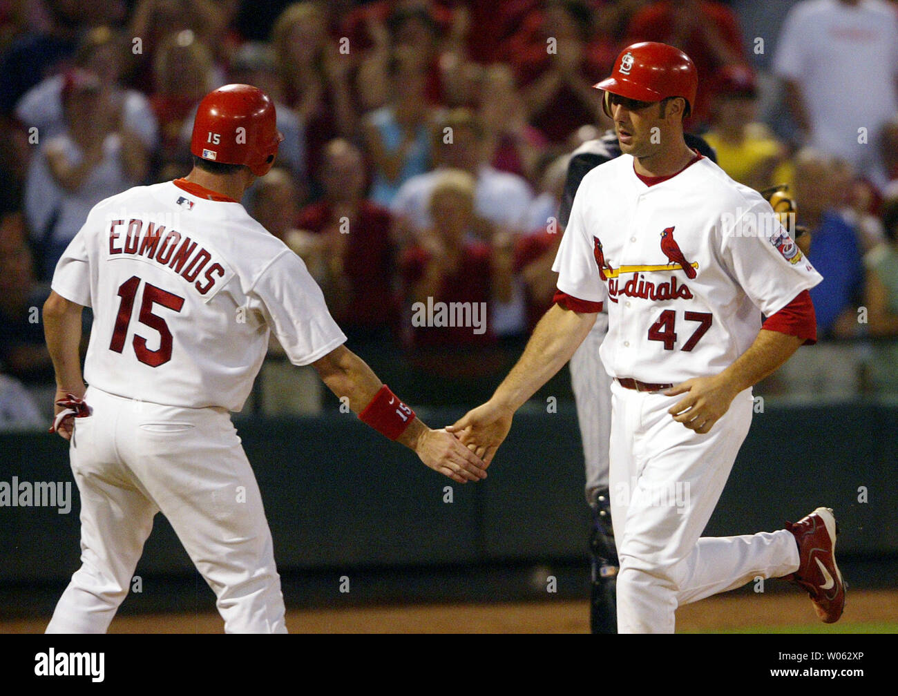 St. Louis Cardinals John Mabry (R) is welcomed home by teammate Jim ...