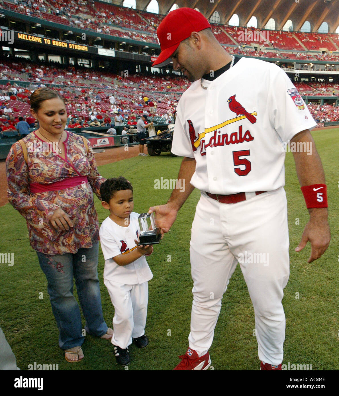 St. Louis Cardinals Albert Pujols hands the Roberto Clemente Award to ...