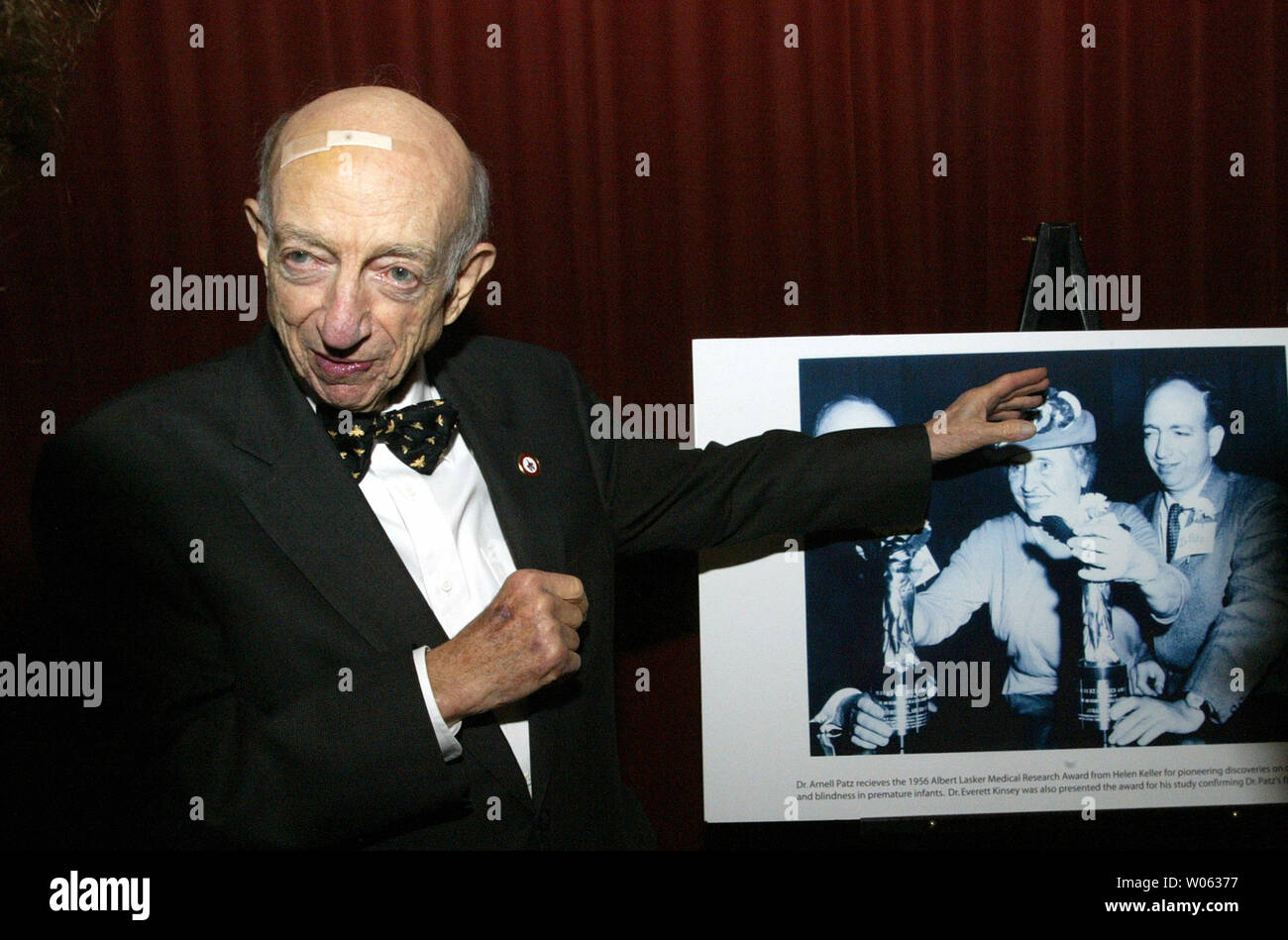 Dr. Arnell Patz of Baltimore, points to a 1950's photo of himself with ...