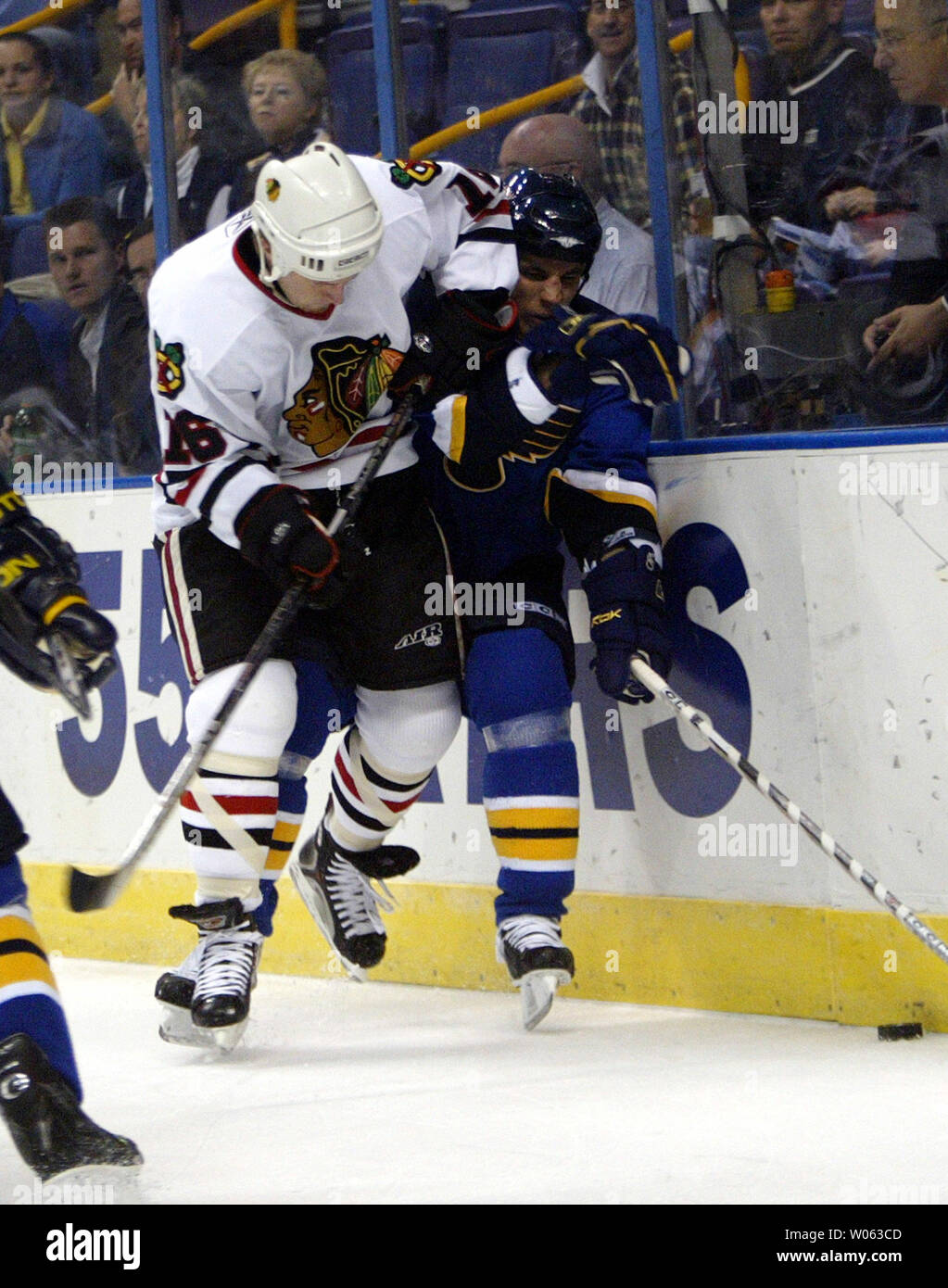 Chicago Blackhawks Matt Ellison (L) rams St. Louis Blues Aaron Downey ...