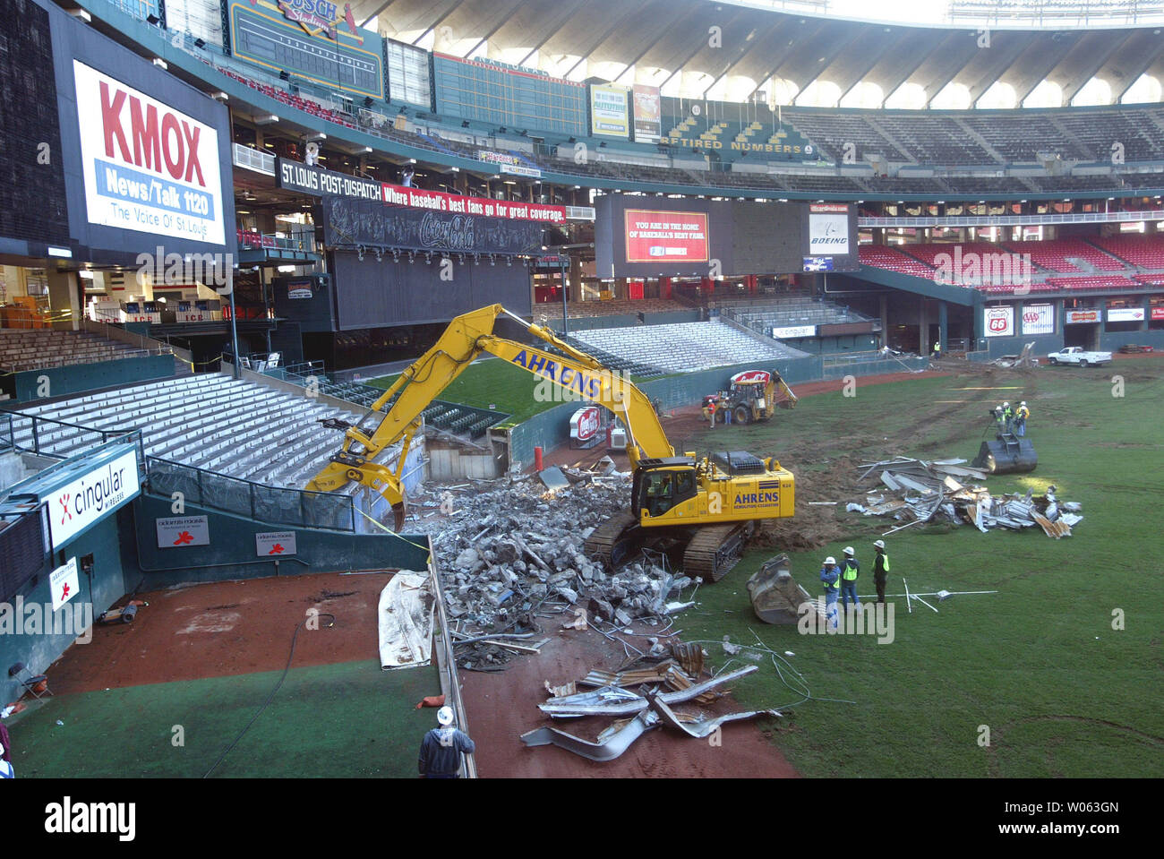 Heavy equiptment crews begin to tear out the bleachers section of Busch ...