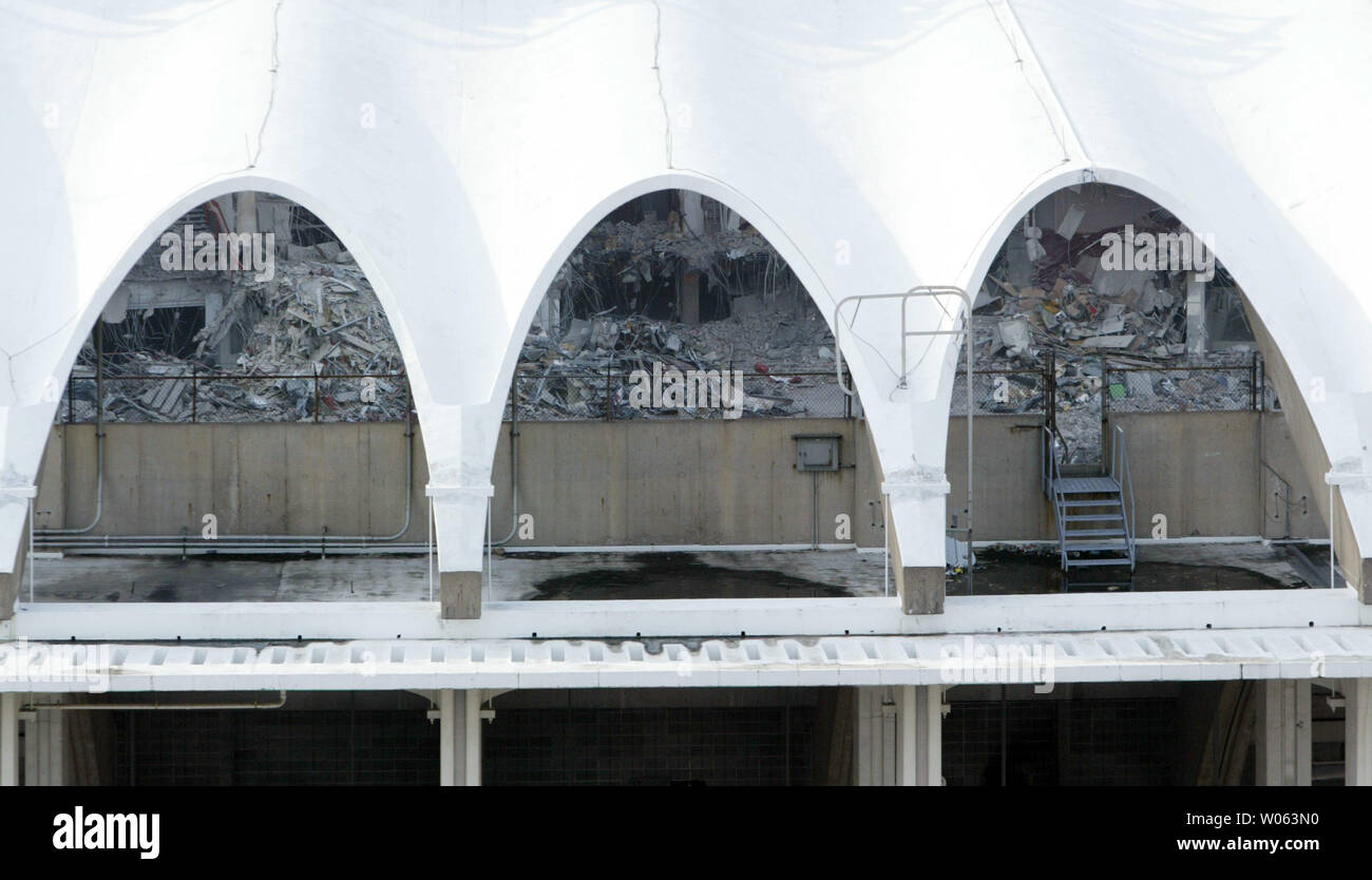 Debris ia all that is left on the field as seen through the arches that ...
