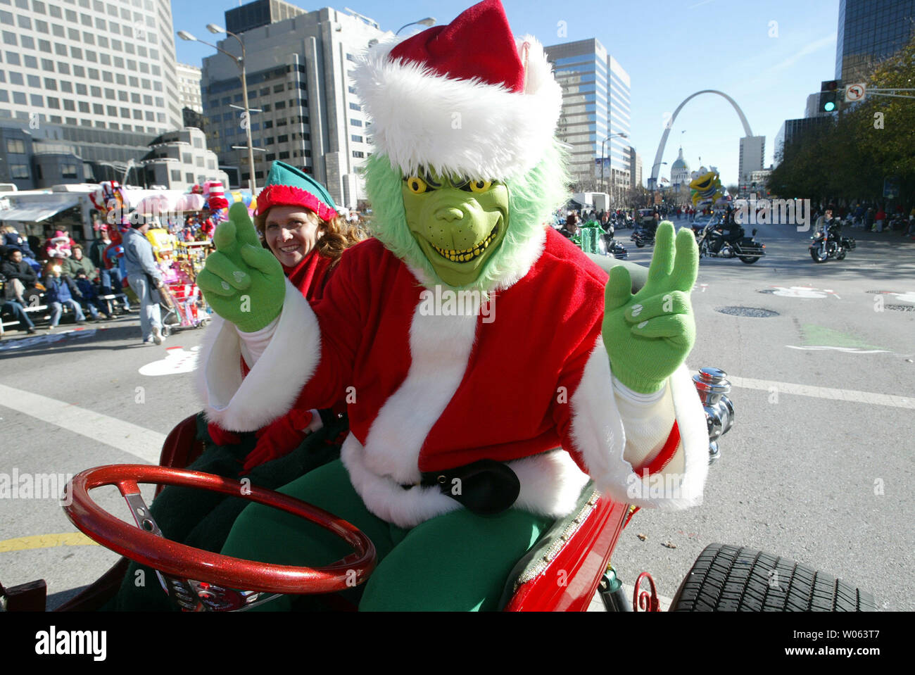 The grinch stops for a photograph while driving in the Christmas in St ...
