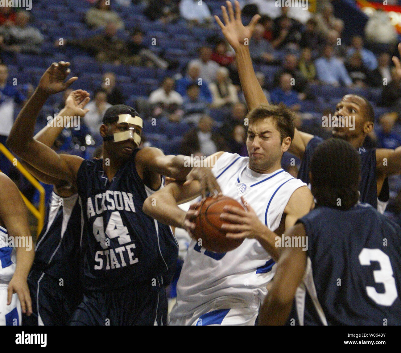 Saint Louis University's Ian Vouyoukas (C) battles Jackson State's ...