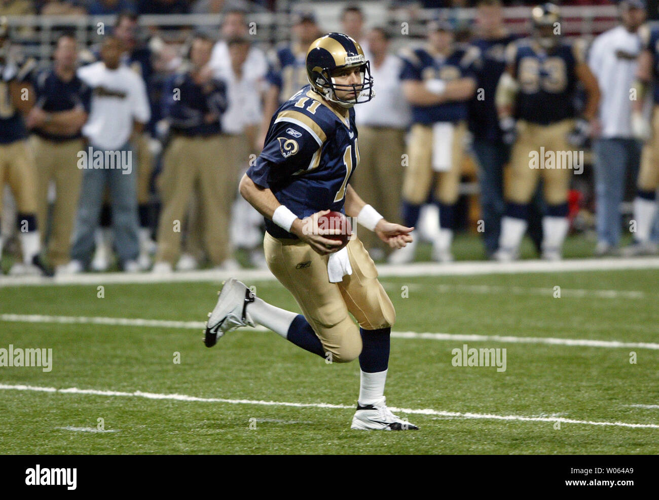 St. Louis Rams quarterback Jamie Martin scrambles out of the pocket ...