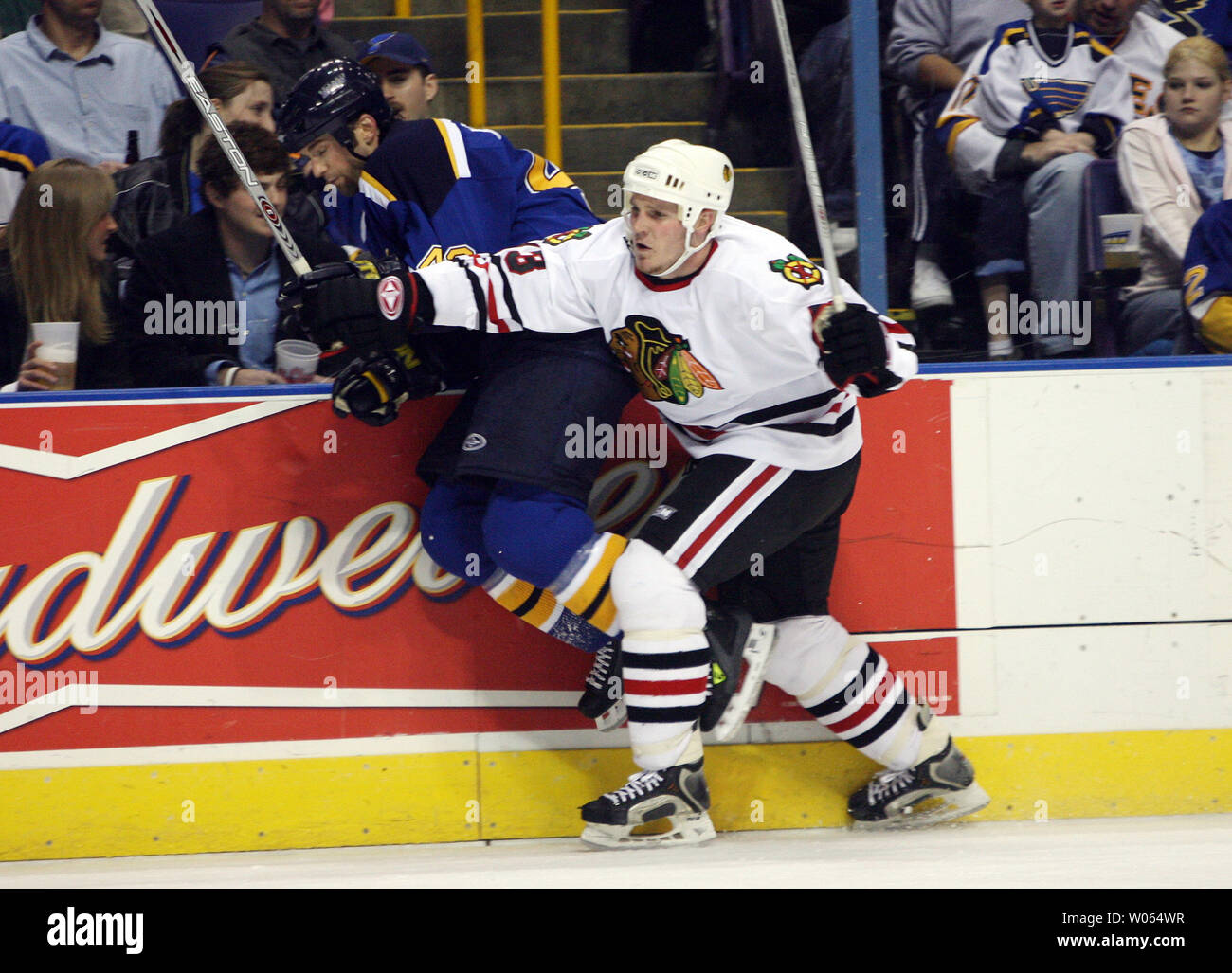 Chicago Blackhawks James Wisniewski (R) puts St. Louis Blues Mark ...